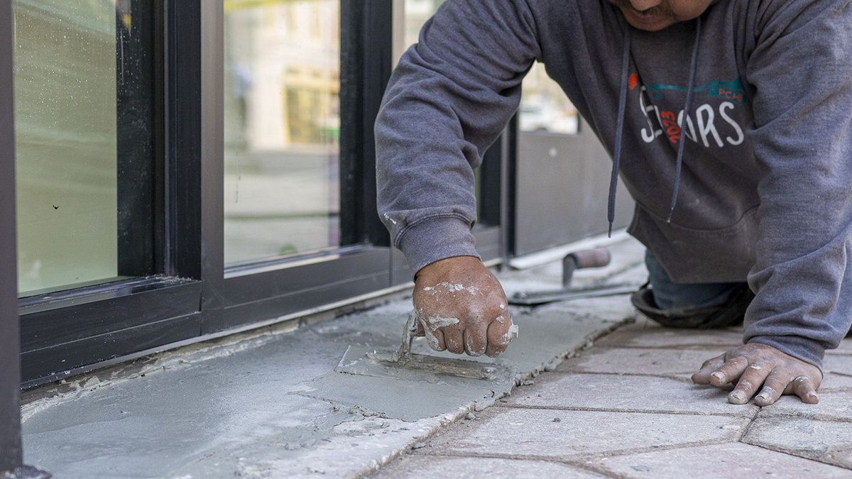 Storefront Entryway Takes Shape with Concrete Finishing at the ...